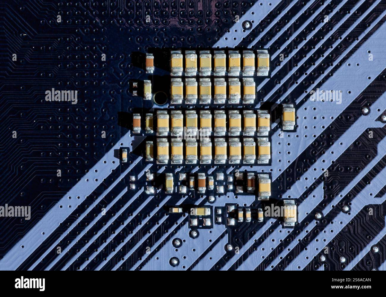 Detailed view of motherboard traces and surface-mounted components ...