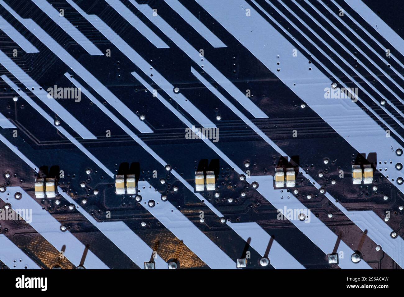 Detailed view of motherboard traces and surface-mounted components ...