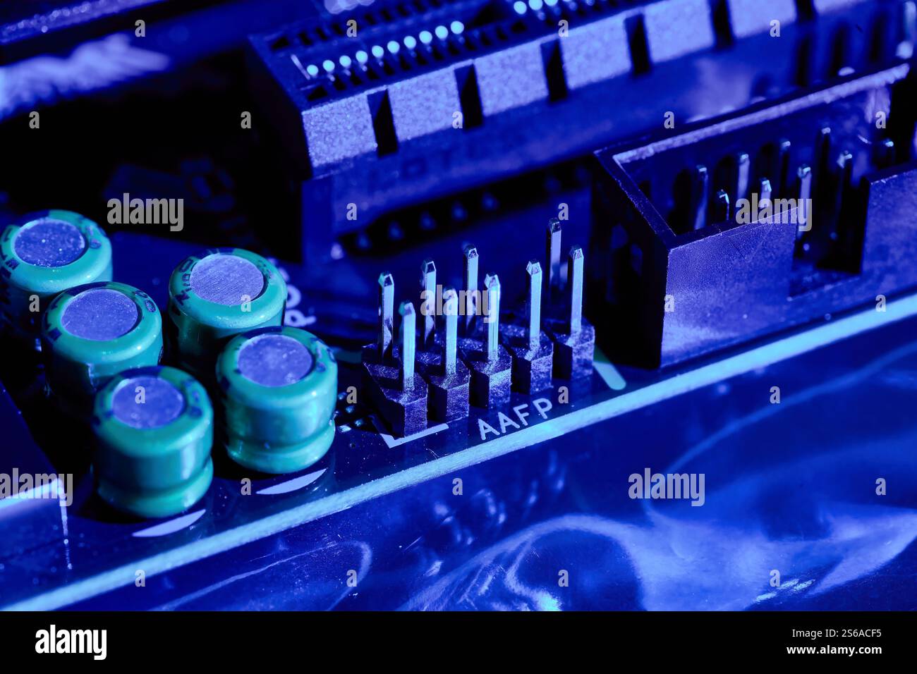 Close-up view of capacitors and connectors on a motherboard ...