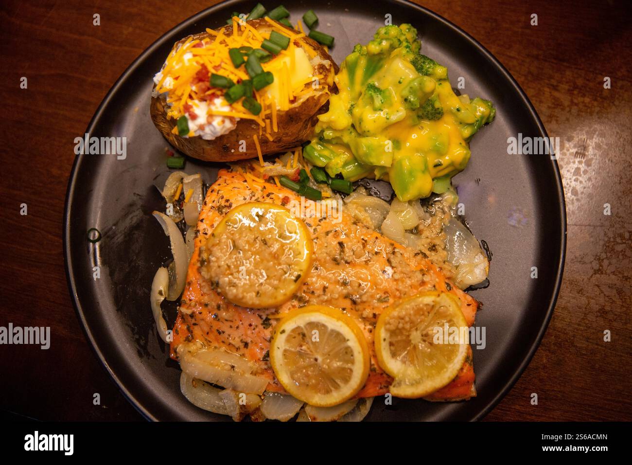 Baked Steelhead trout with sides Stock Photo - Alamy