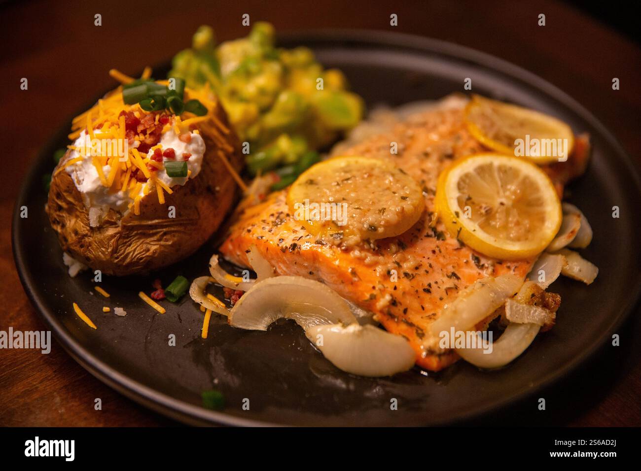 Baked Steelhead trout with sides Stock Photo - Alamy