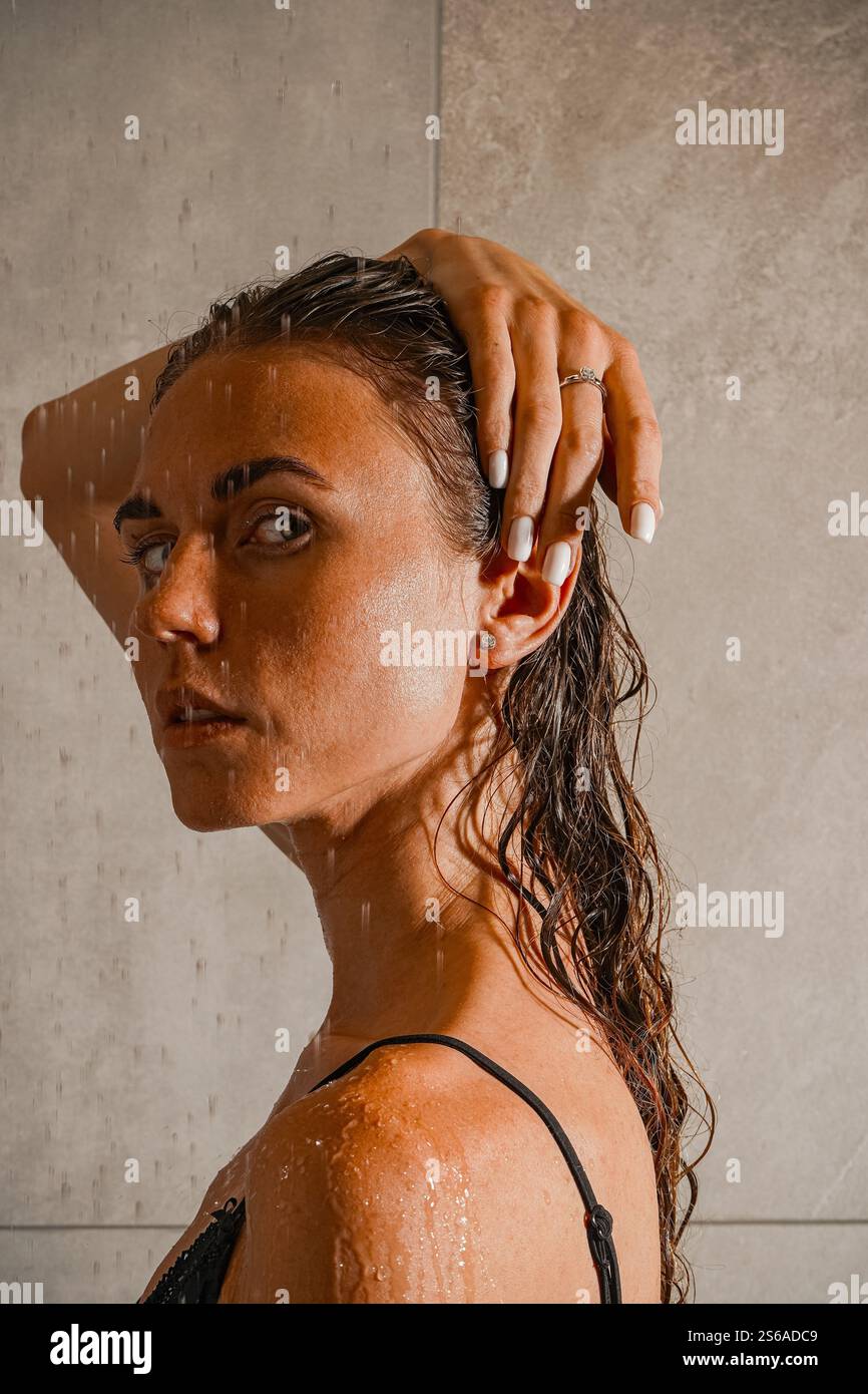 The soft lighting enhances her natural beauty and grace. A close-up of ...