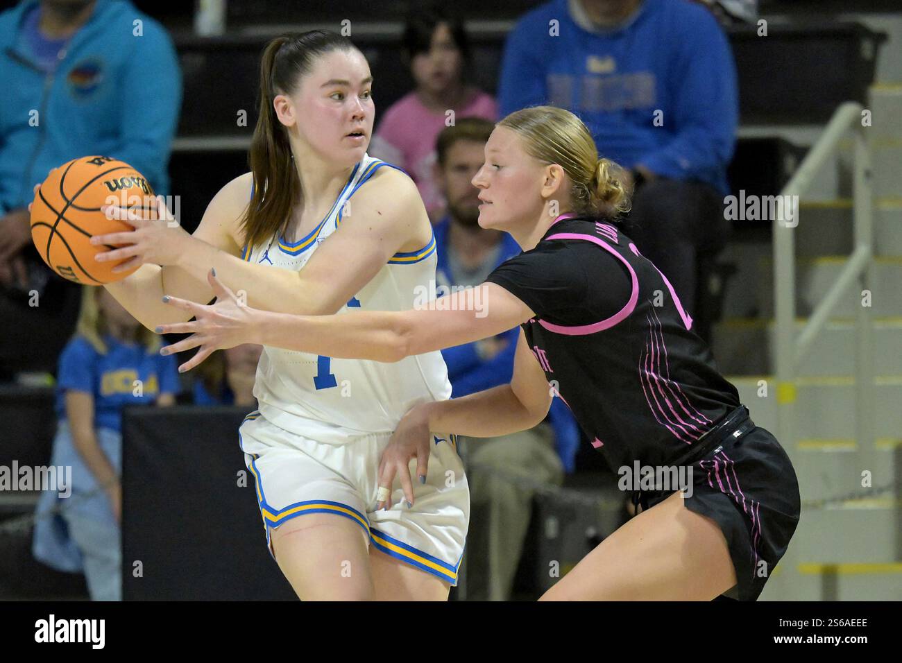 UCLA guard Elina Aarnisalo, left, is pressured by Penn State guard Alli ...