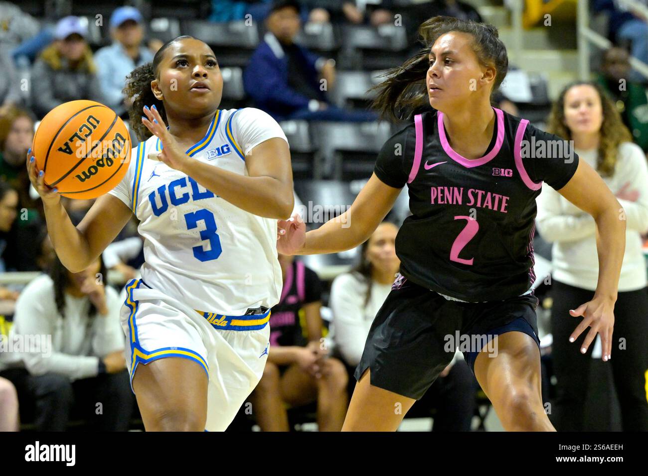 UCLA guard Londynn Jones, left, drives past Penn State guard Shaelyn ...