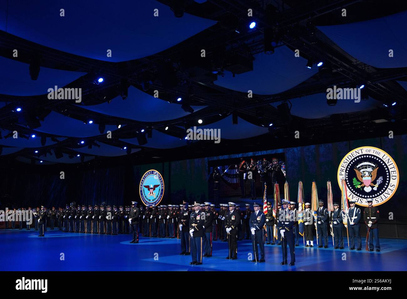 Members of the military stand during a Department of Defense Commander ...