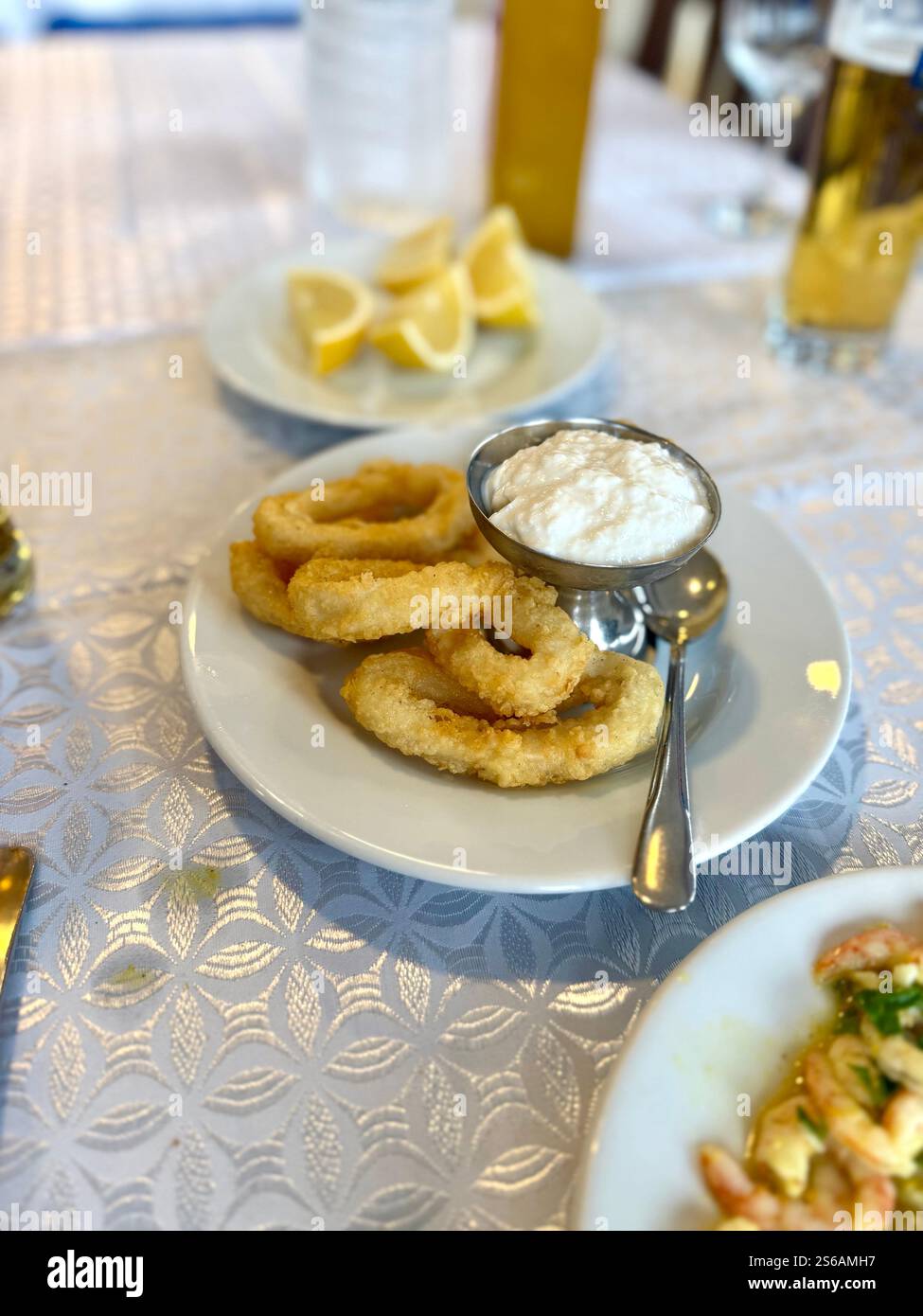 Raki appetizer Crispy Fried Calamari with tartar sauce served at fish ...