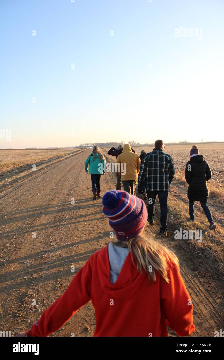 Group of People walking down country road in Minnesota Stock Photo - Alamy