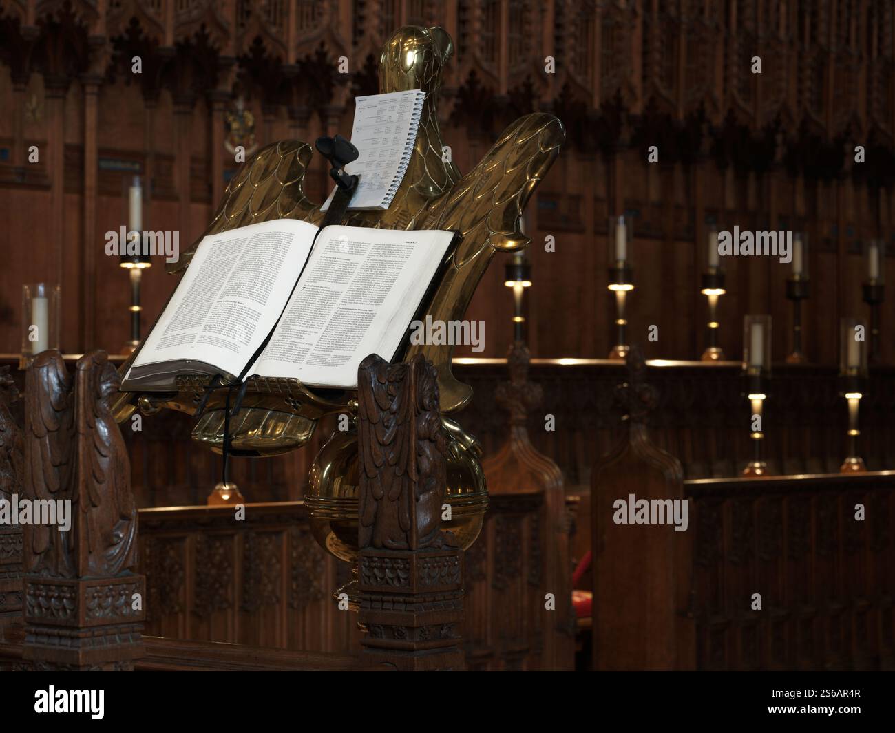 Open Bible on a lectern in the Choir at Peterborough Cathedral, England ...