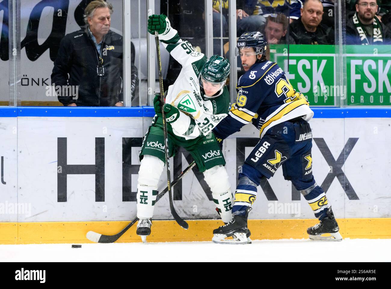 250116 Färjestads Wille Johansson och HV71s Jamiro Reber under ...