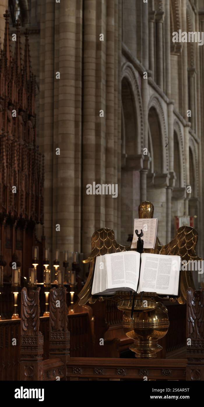 Open Bible on a lectern in the Choir at Peterborough Cathedral, England ...