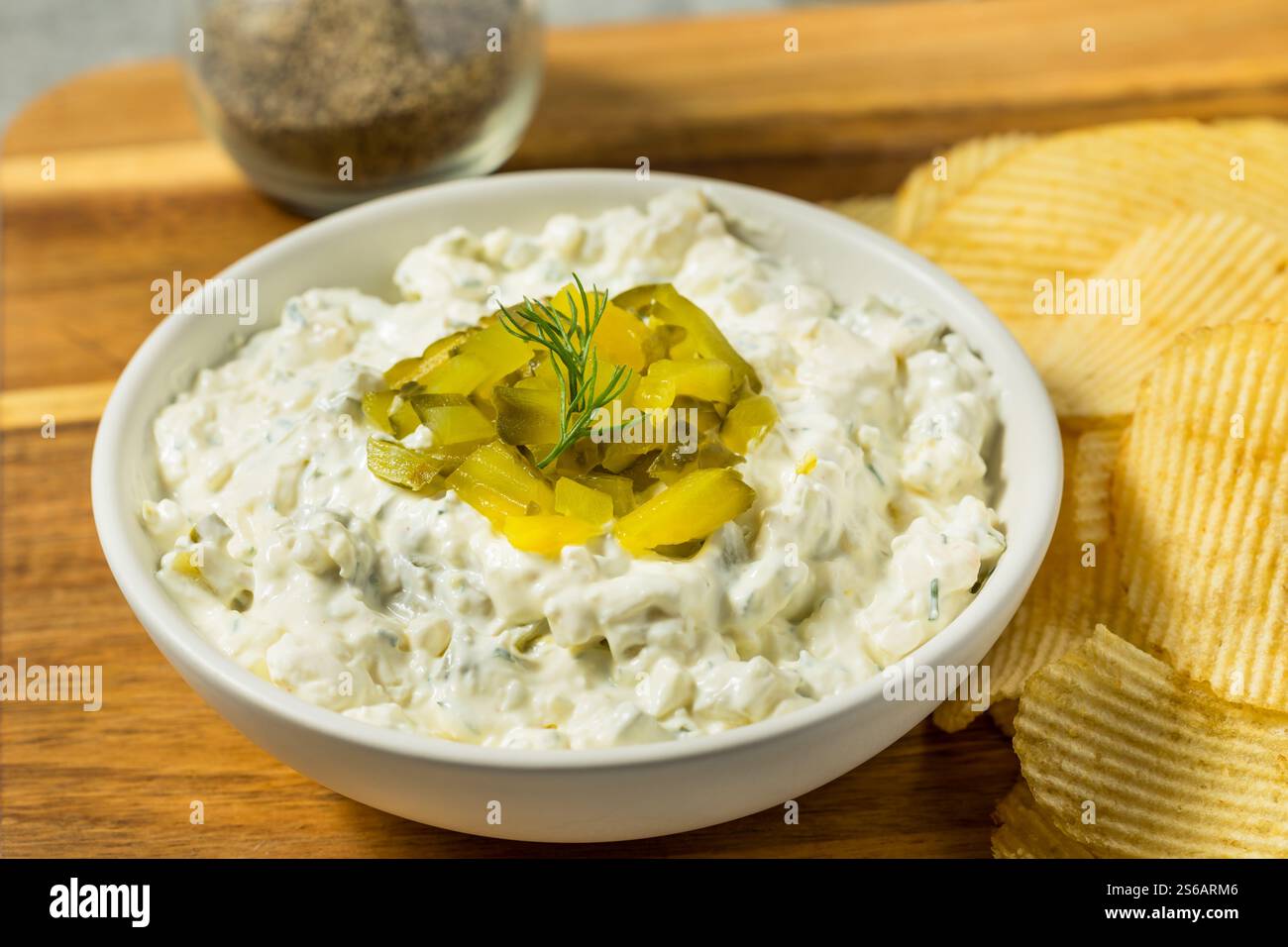 Creamy Pickle Dip with Mayo for an Appetizer with Potato Chips Stock ...