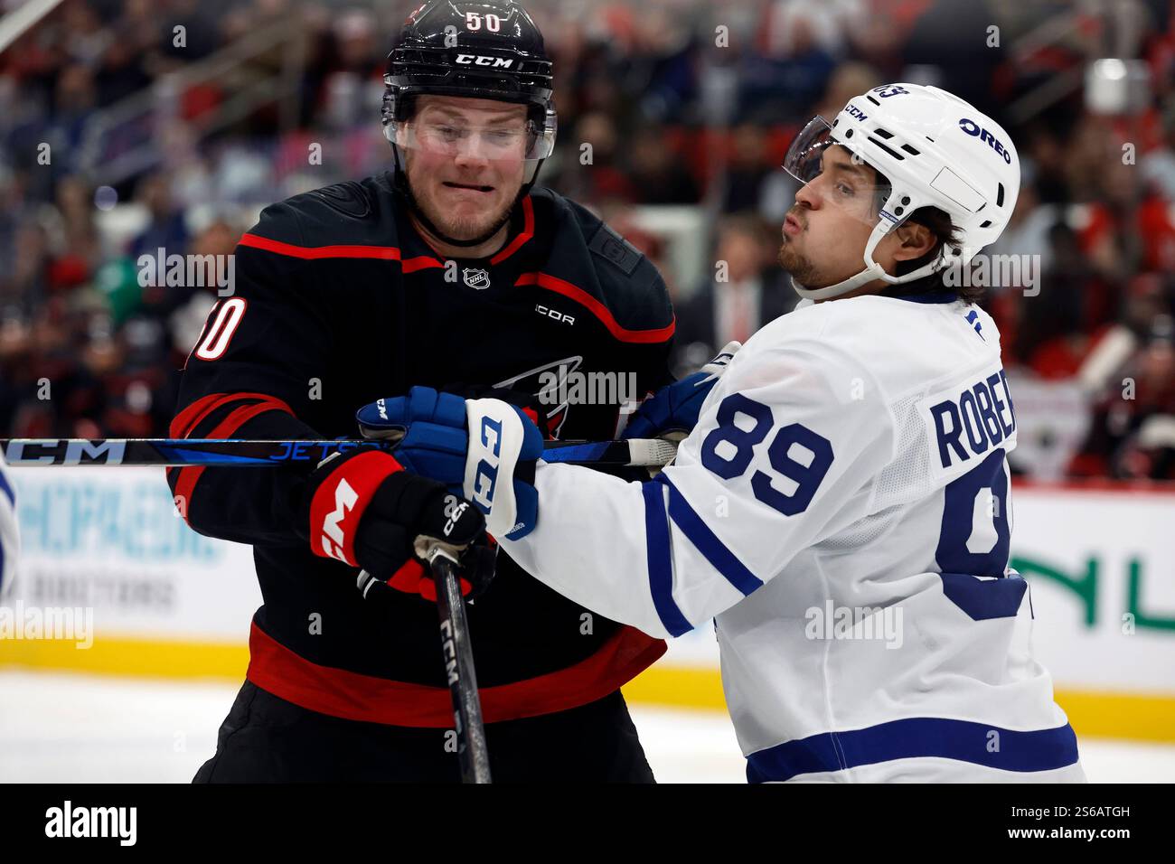 Carolina Hurricanes' Eric Robinson (50) scuffles with Toronto Maple ...