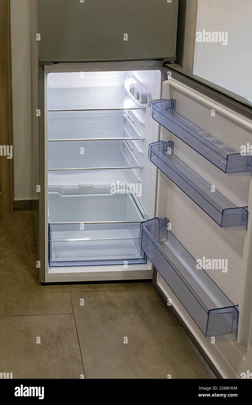 Modern empty refrigerator with open door inside home interior Stock ...