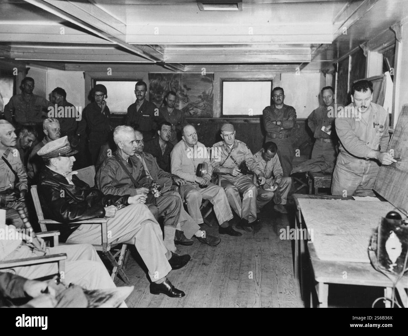 General Douglas MacArthur attends a briefing session during Korean War ...