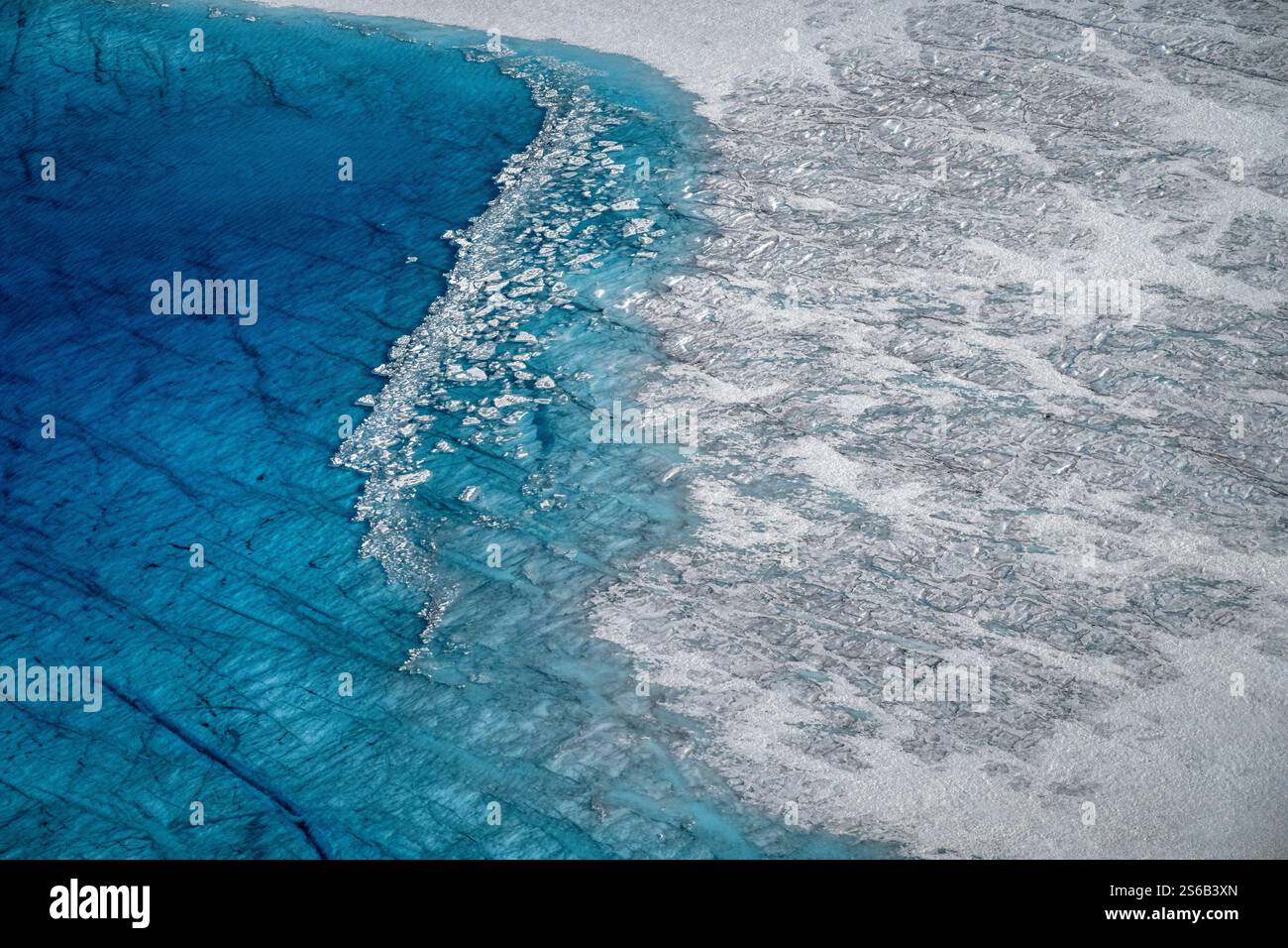 Bright blue pool forms on glacier surface during summer melt season ...