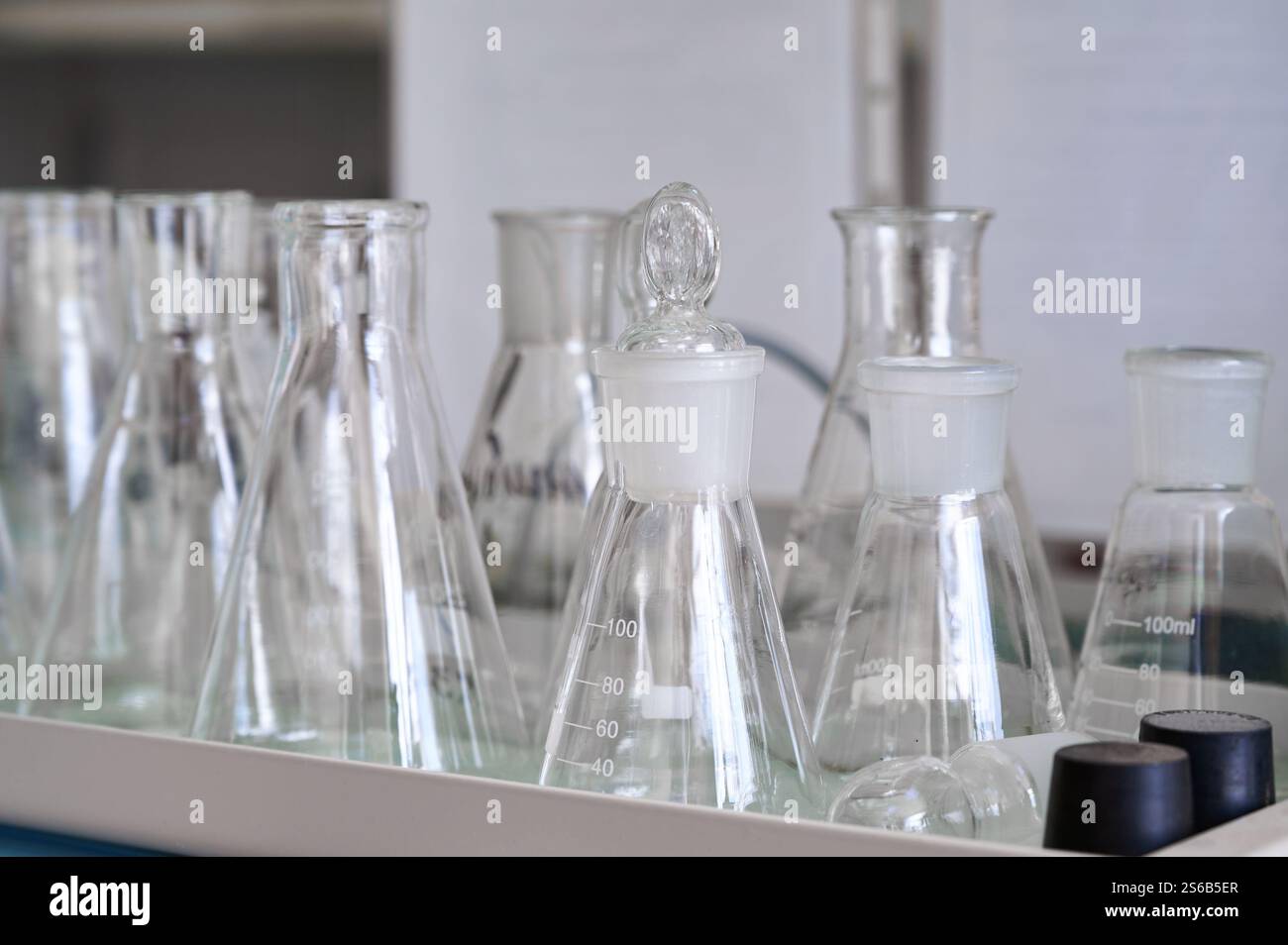 Various laboratory glassware displayed on a counter in a modern science ...