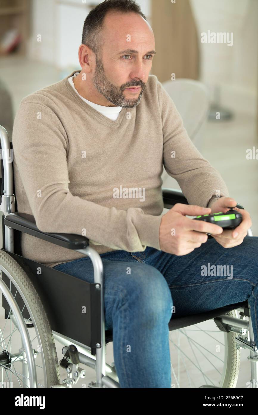Disabled man playing video game hi-res stock photography and images - Alamy