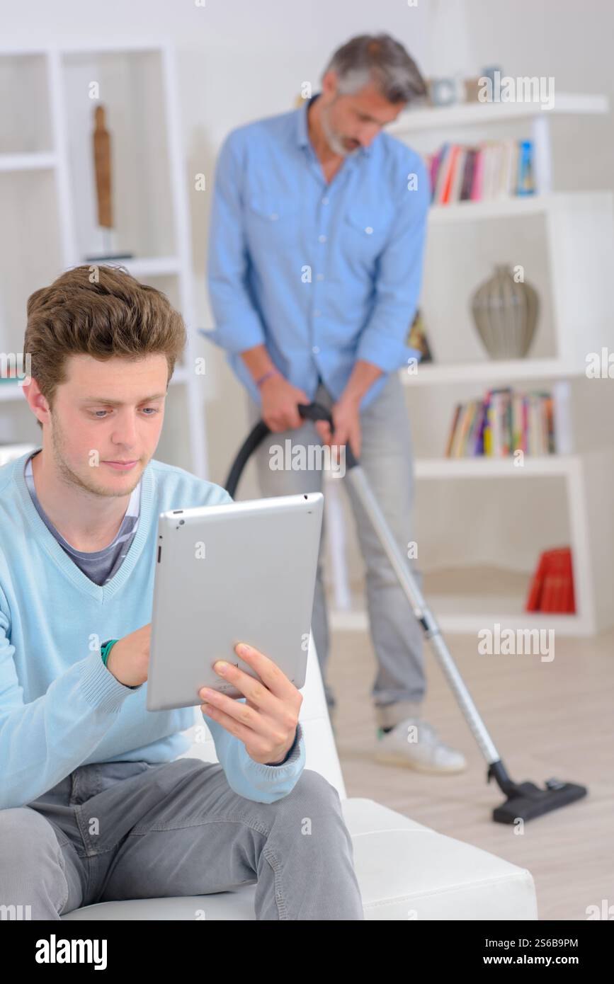 father and son - house chores Stock Photo - Alamy