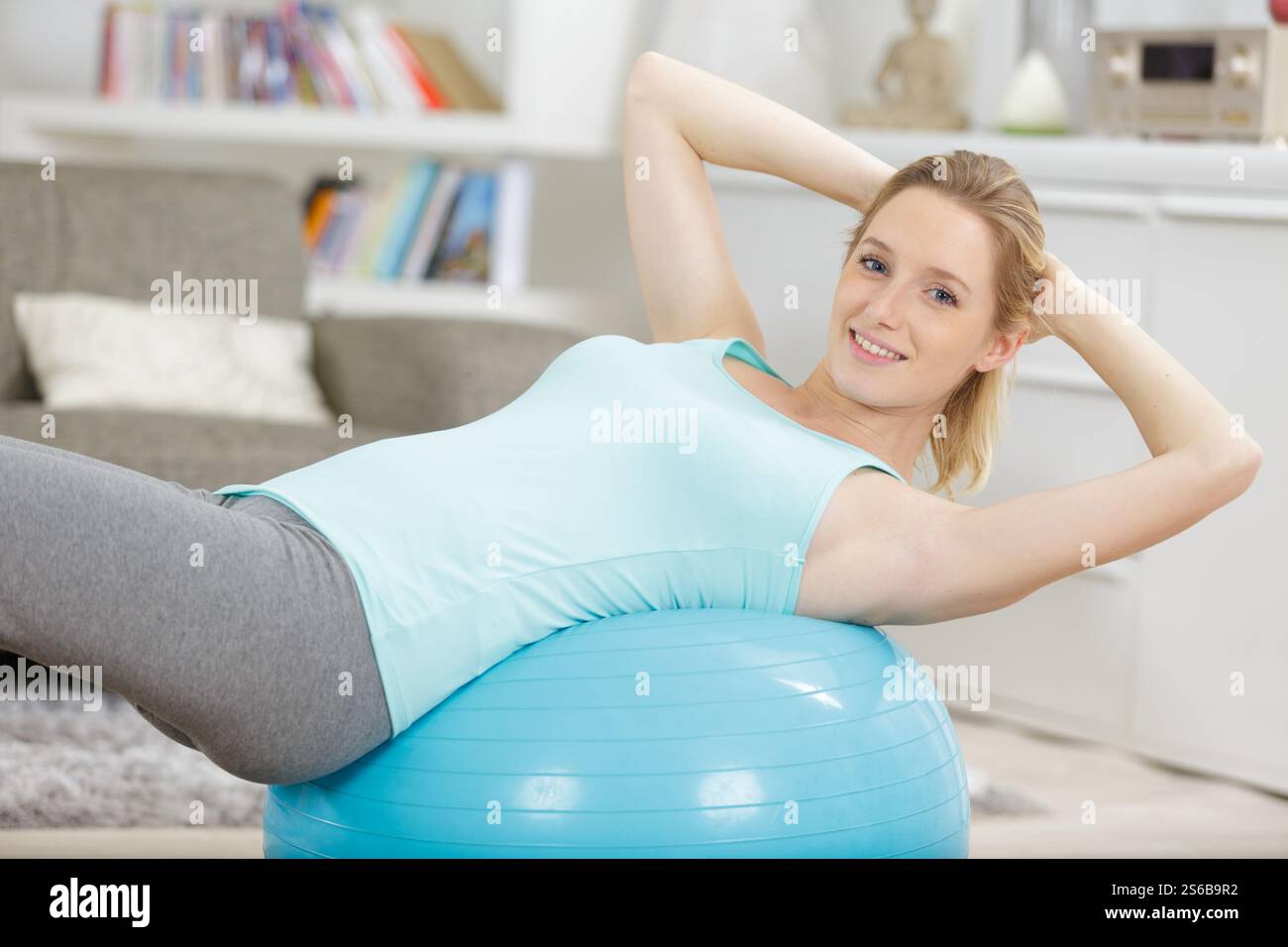 fit women doing sit-ups on exercise balls Stock Photo - Alamy