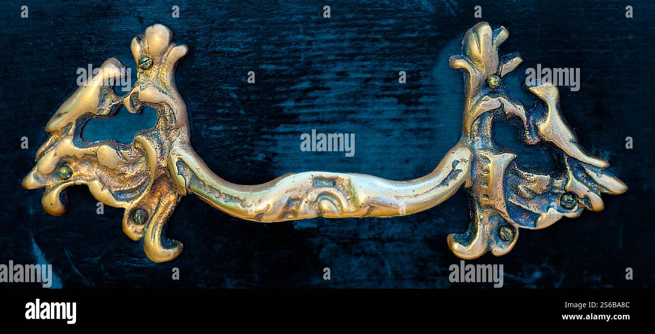 Gold drawer handles - antique Stock Photo - Alamy