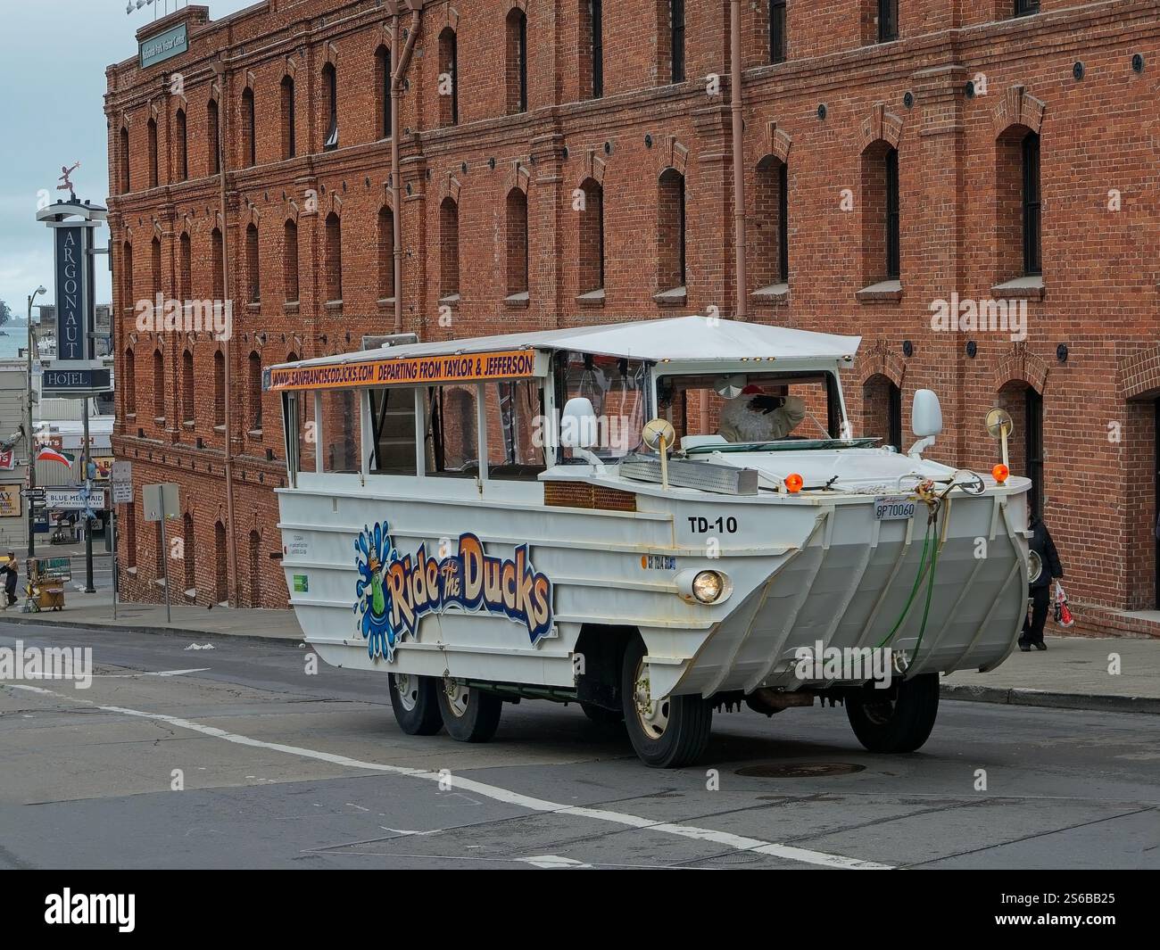 World War II vintage duck boat passing in front of the historic Haslett ...