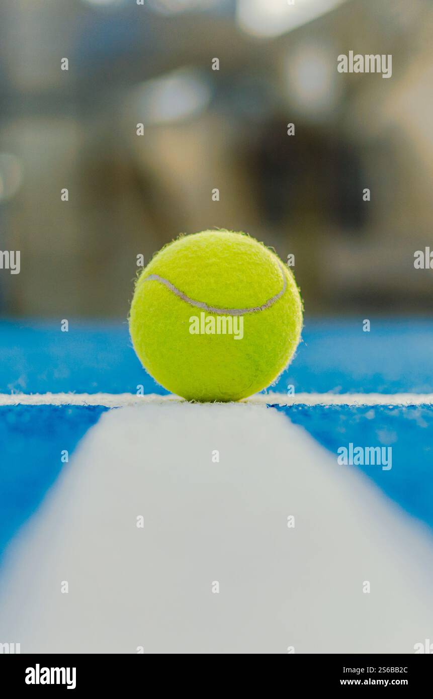 ball on the line cross of a blue paddle tennis court padel background ...