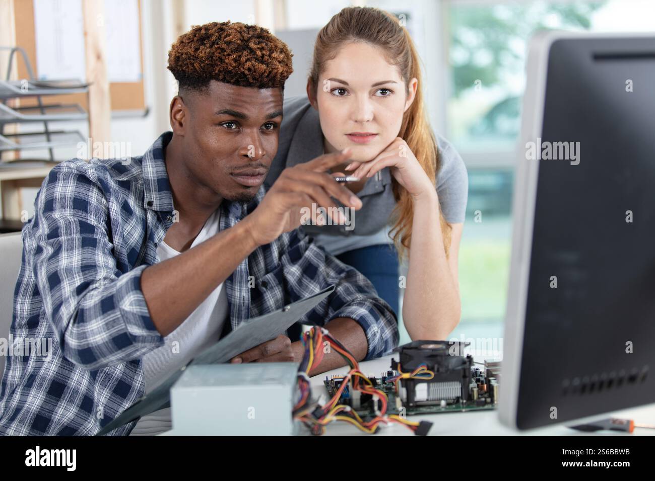 Team technicians repairing electronics hi-res stock photography and ...