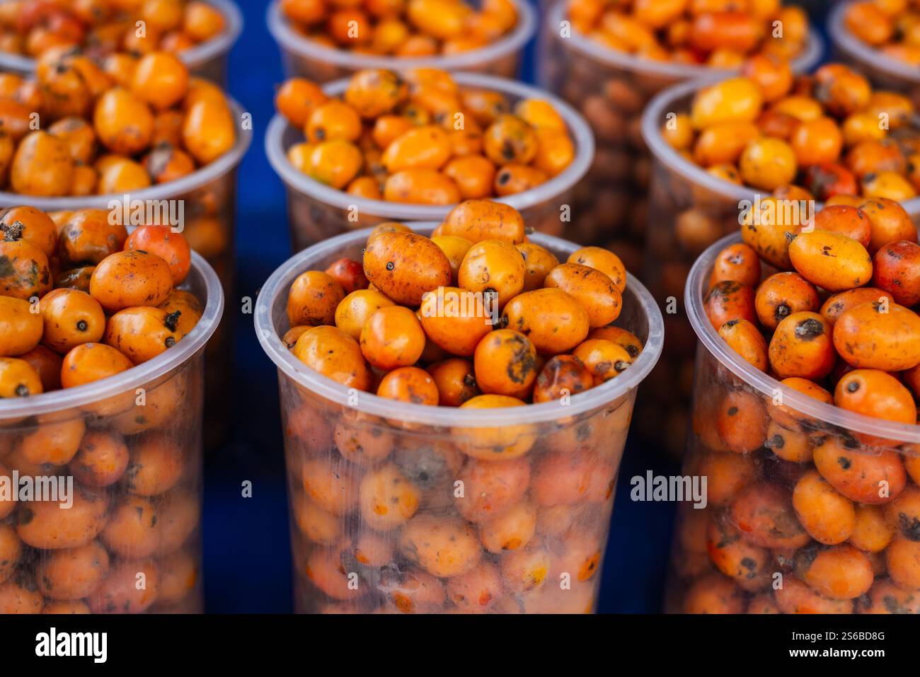 Seriguelas for sale at a market. Fruit source of fiber rich in vitamin ...