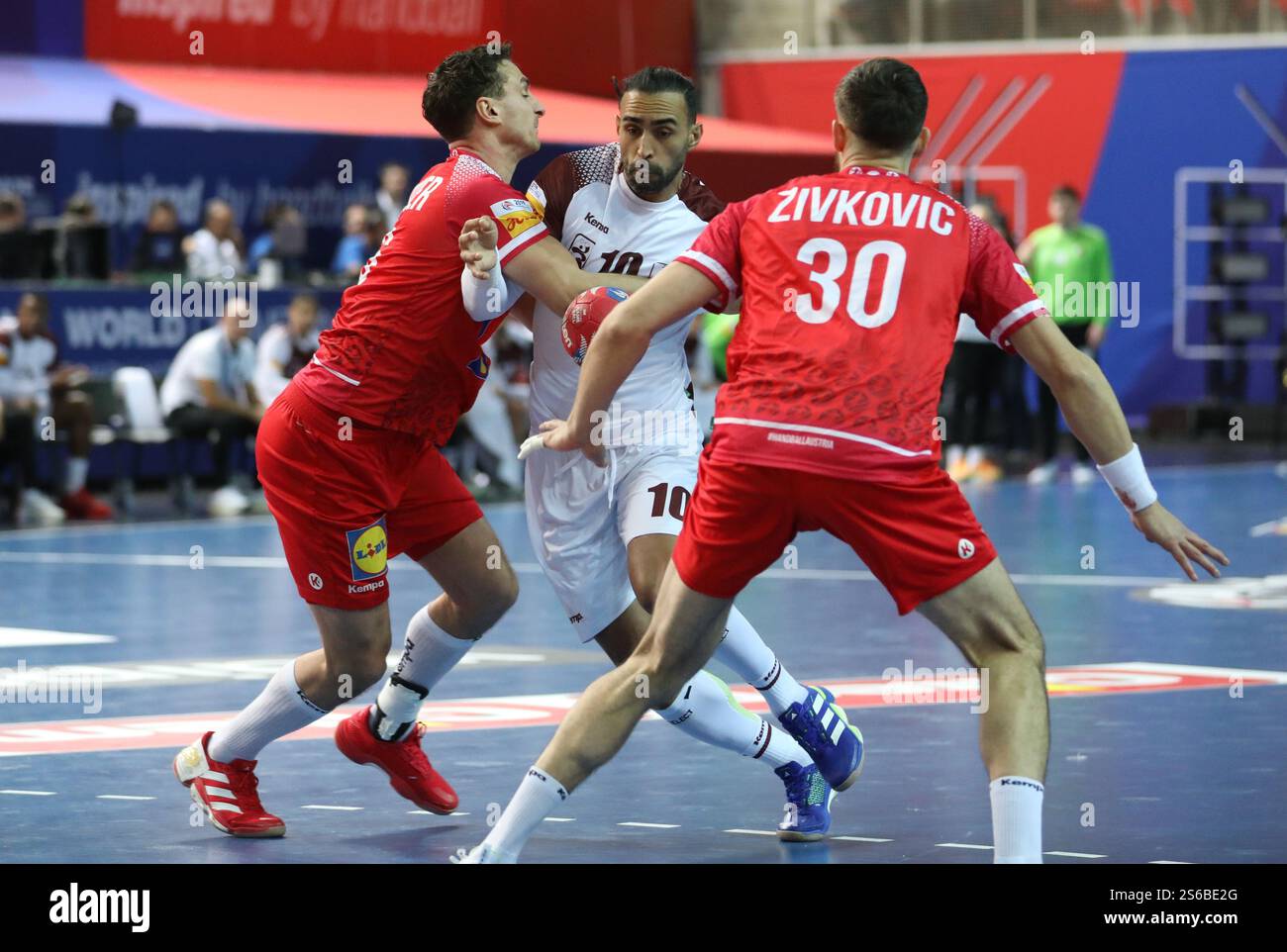 POREC, CROATIA - JANUARY 16: Frankis Marzo of Qatar in action against Lukas Herburger of Austria ...