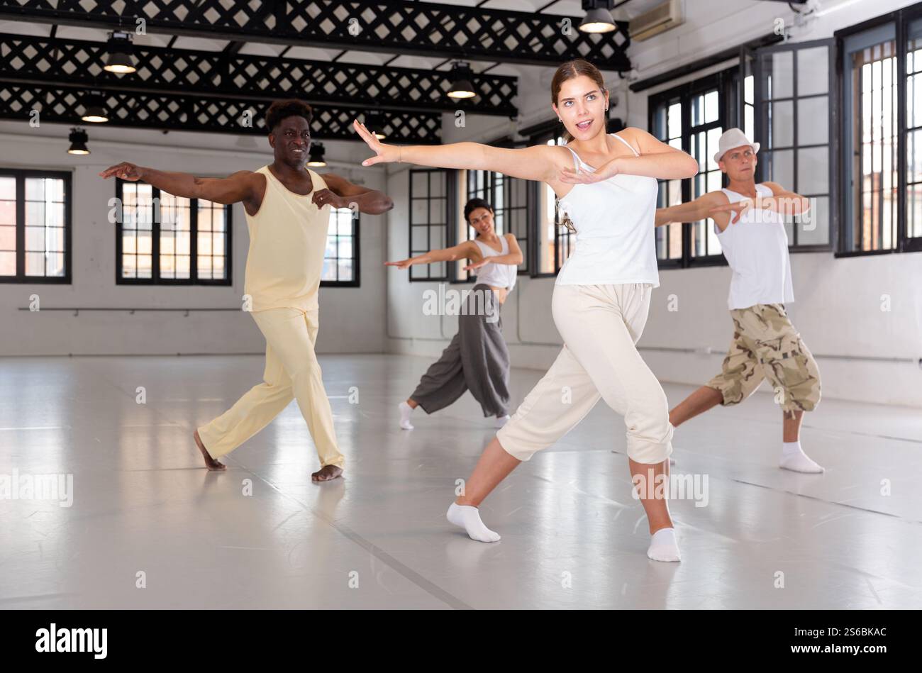 Four dancers exercising contemporary dance movements Stock Photo - Alamy