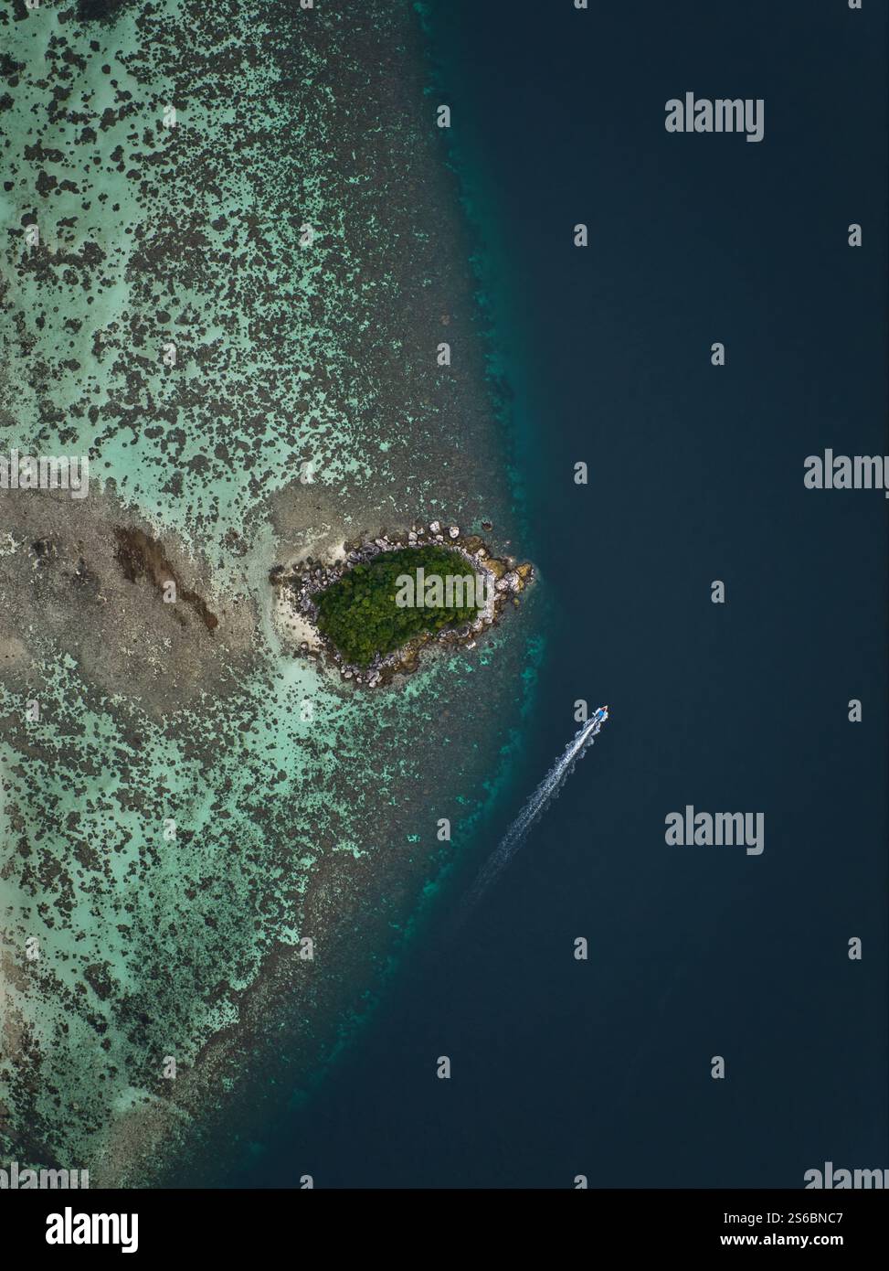 Aerial view of a tiny islet near Koh Lipe, Thailand, surrounded by ...