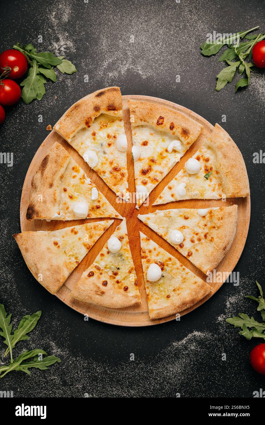 Cheesy pizza slices topped with mini mozzarella, ready to share for the ...