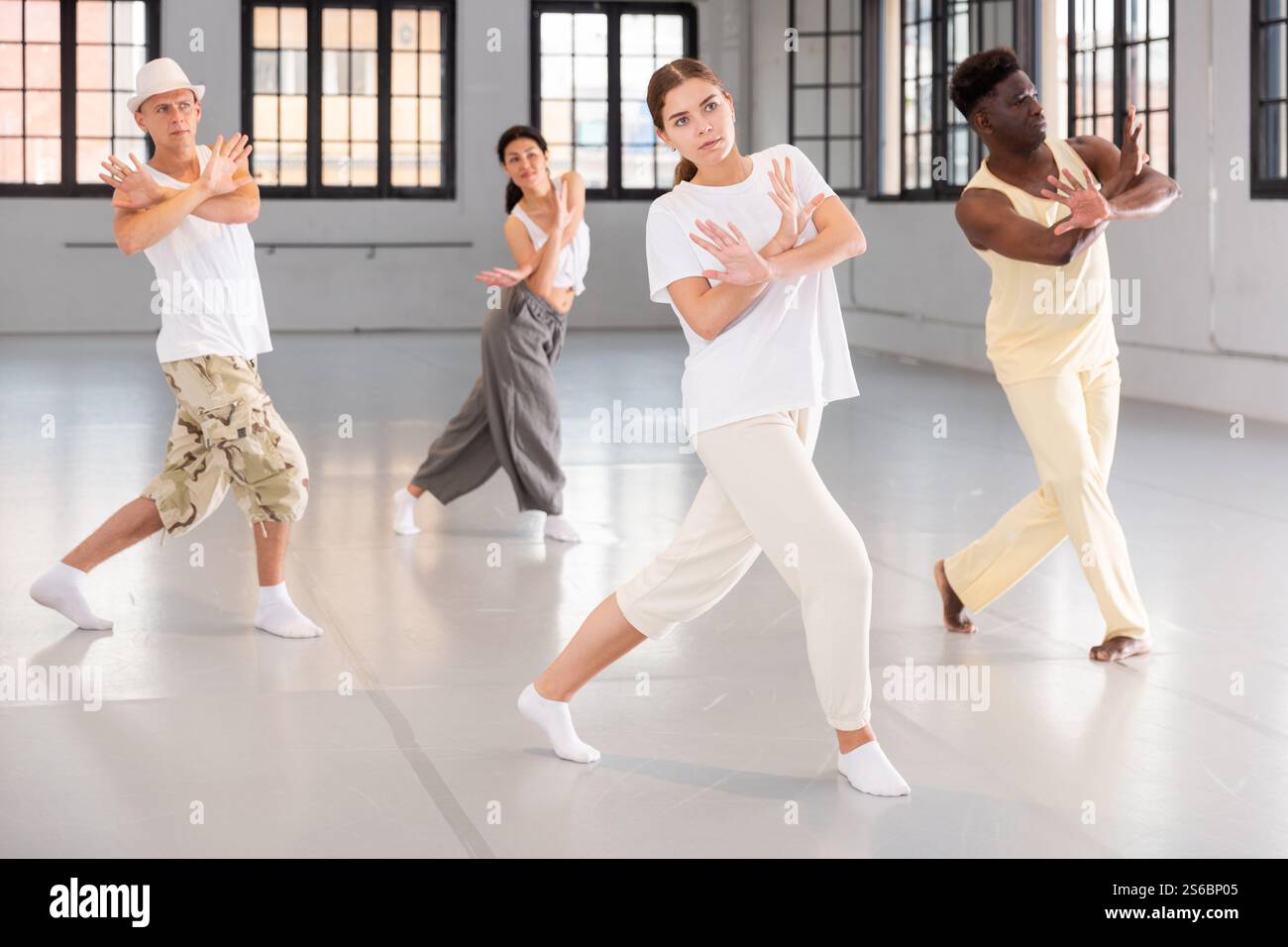 Four dancers exercising contemporary dance movements Stock Photo - Alamy