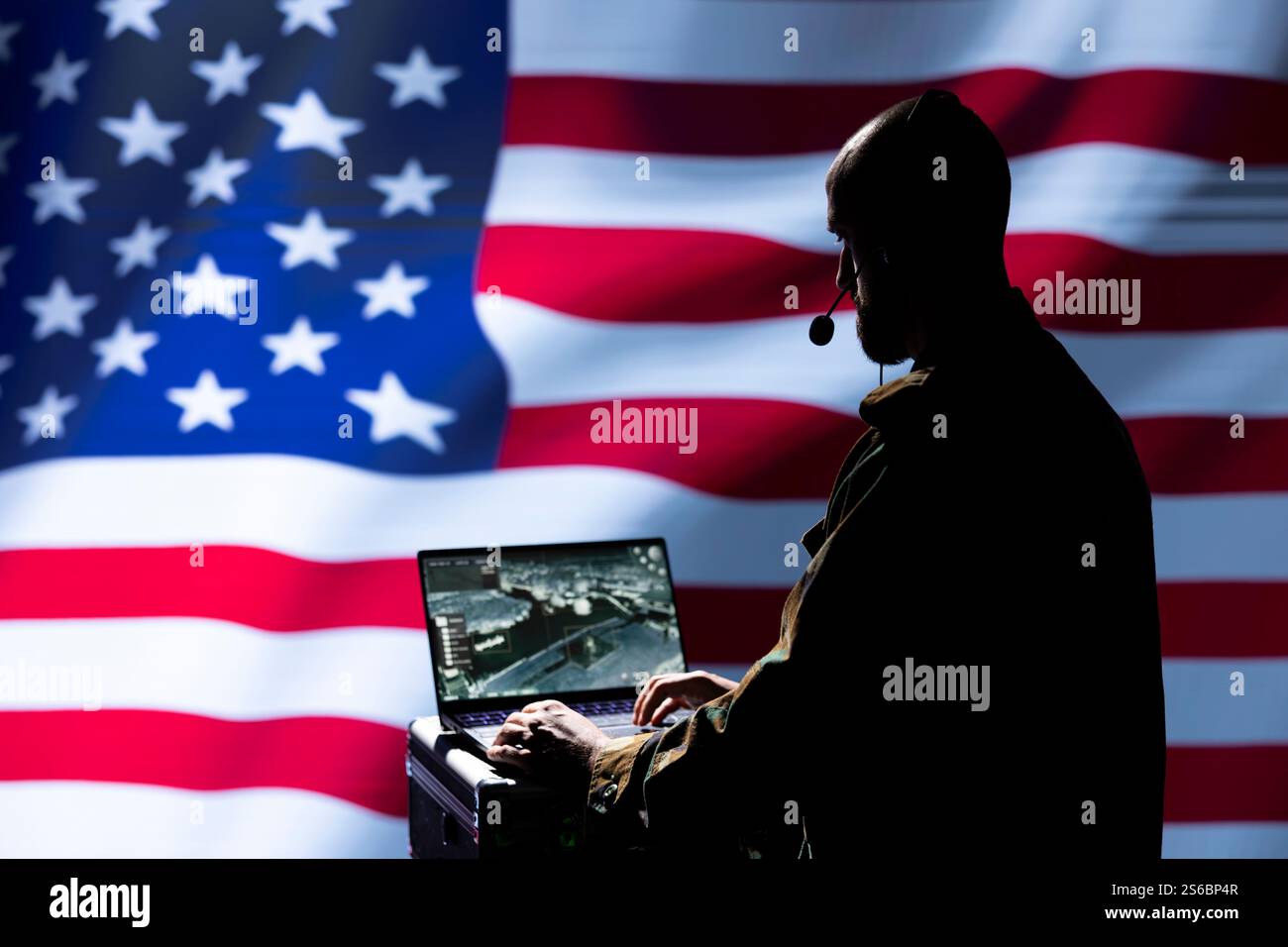 US military officer using target acquisition software on laptop to ...