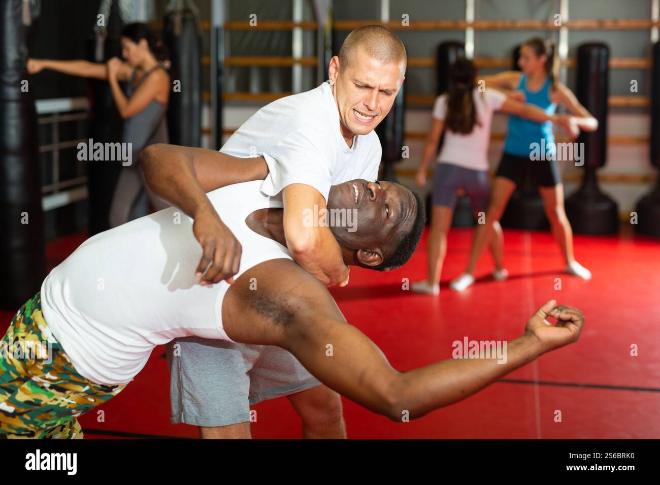 Men doing strength techniques in self defense training Stock Photo - Alamy