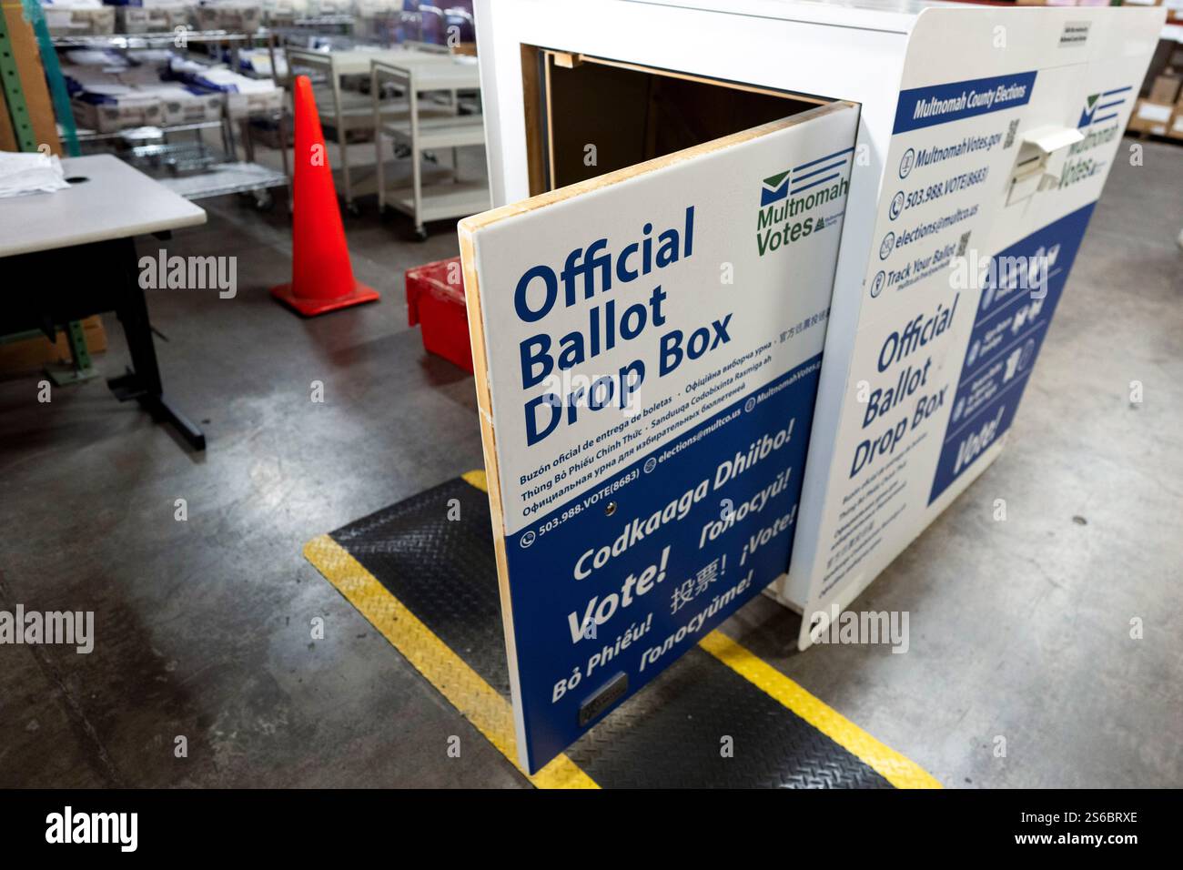 FILE - A damaged election ballot drop box is displayed during a news ...