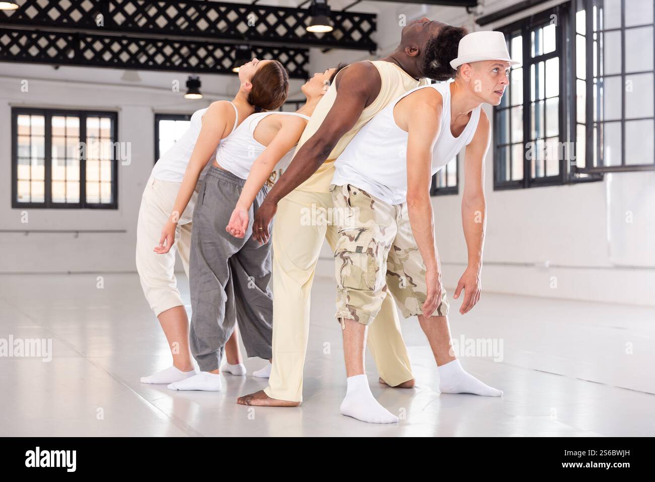 Group of young people learning modern dance movements Stock Photo - Alamy