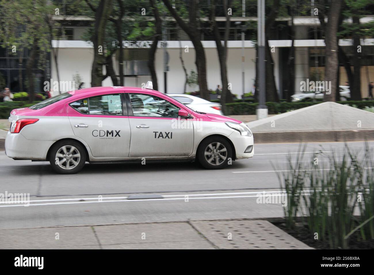 Mexico City, Mexico - Oct 2 2024: Pink taxi vehicle that offers service ...