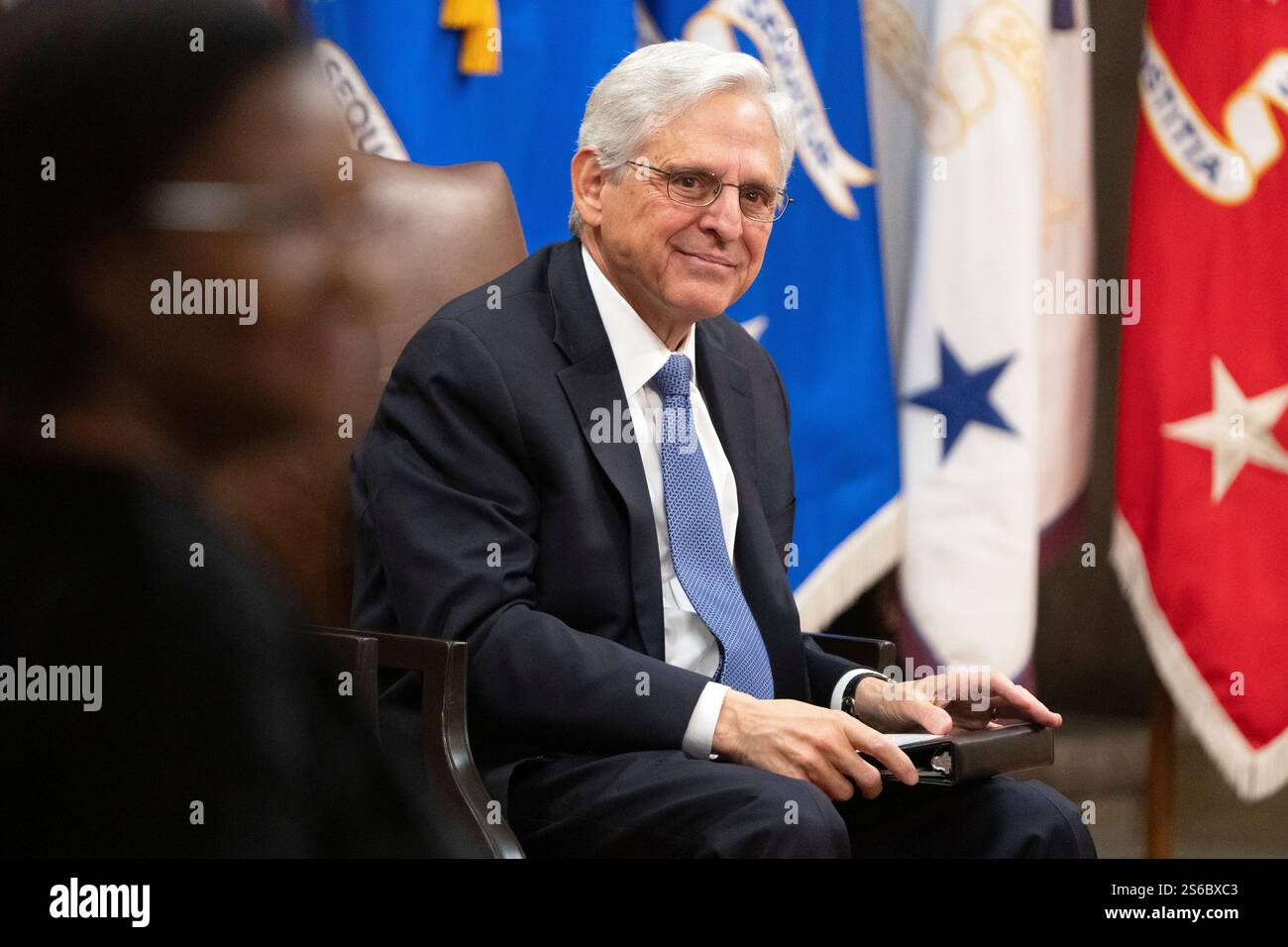 Attorney General Merrick Garland sits during a farewell ceremony at the ...