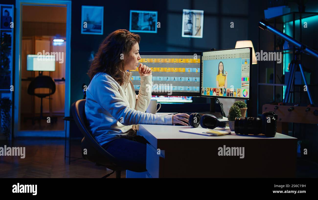 Photographer using professional photo editing tools on PC display ...