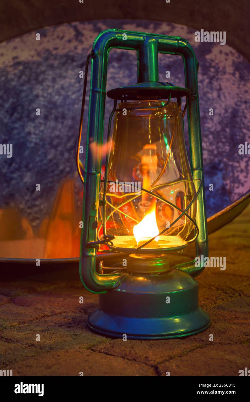 kerosene paraffin lamp classic , yellow light night outdoors, sitting ...