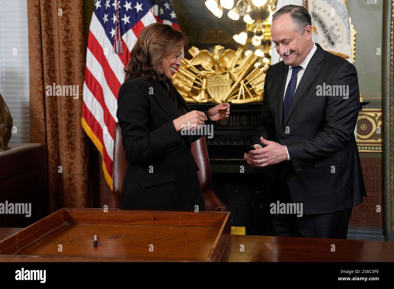 Vice President Kamala Harris, left, watches as second gentleman Doug ...