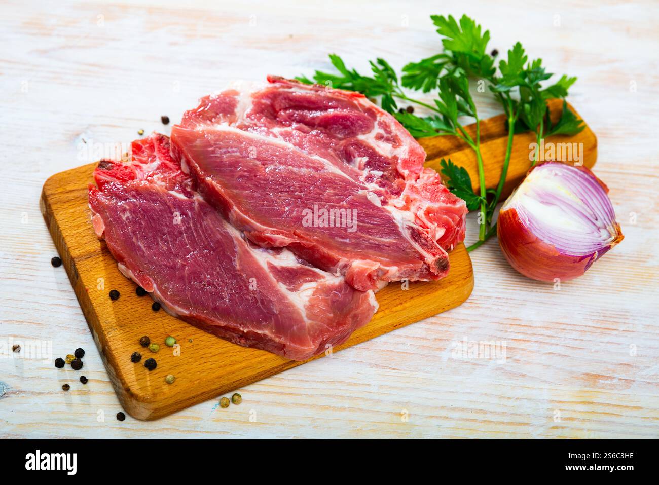 Raw pork chop Stock Photo - Alamy
