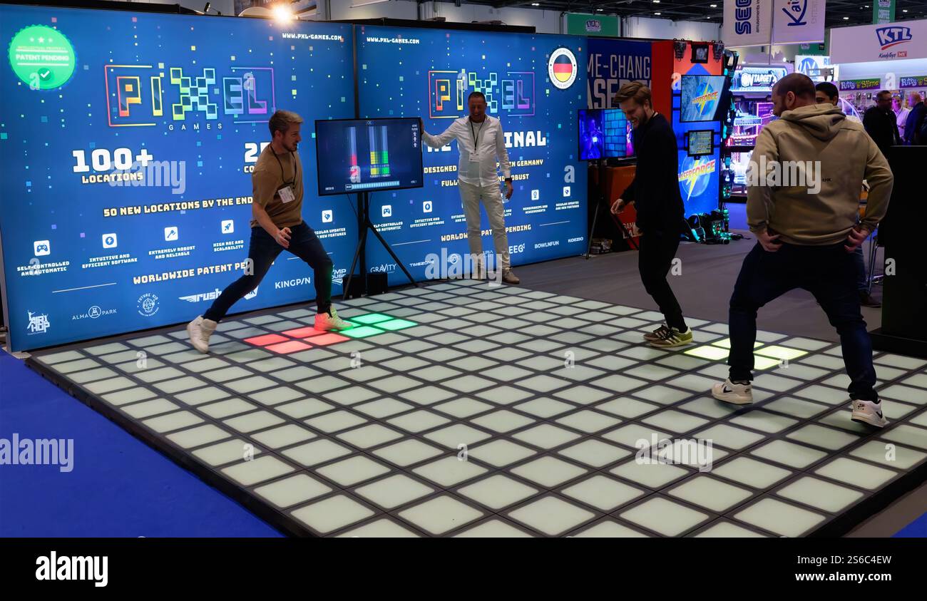 Man competing on a gaming floor at the EAG Expo Europe 2025 exhibition ...