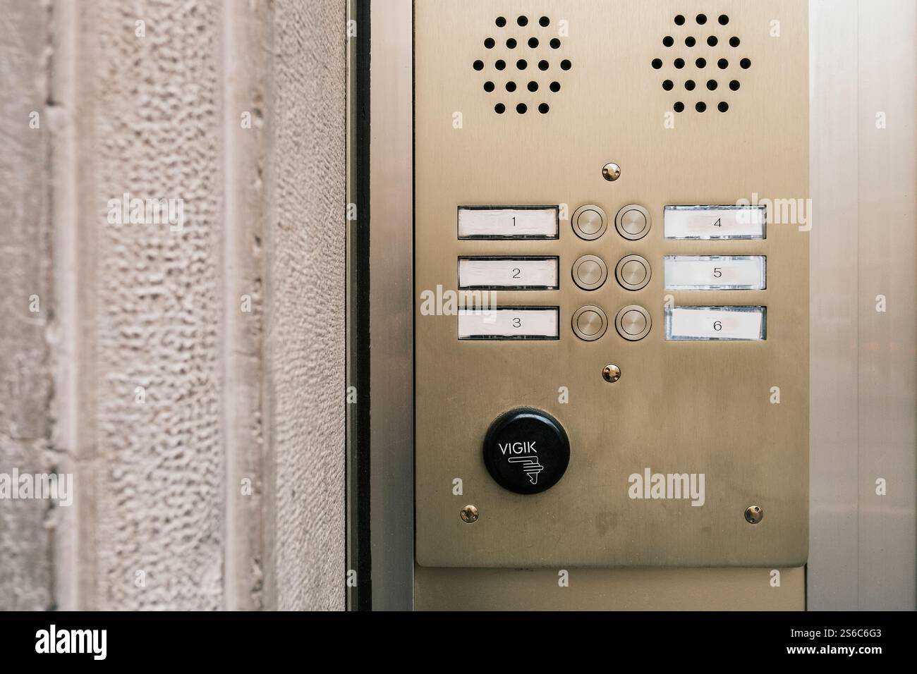Intercom system with six doorbell buttons on building exterior wall Stock Photo - Alamy