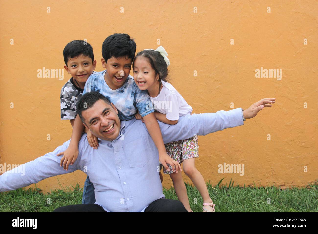 Single Dad with two brown latino sons and daughter spend time together ...