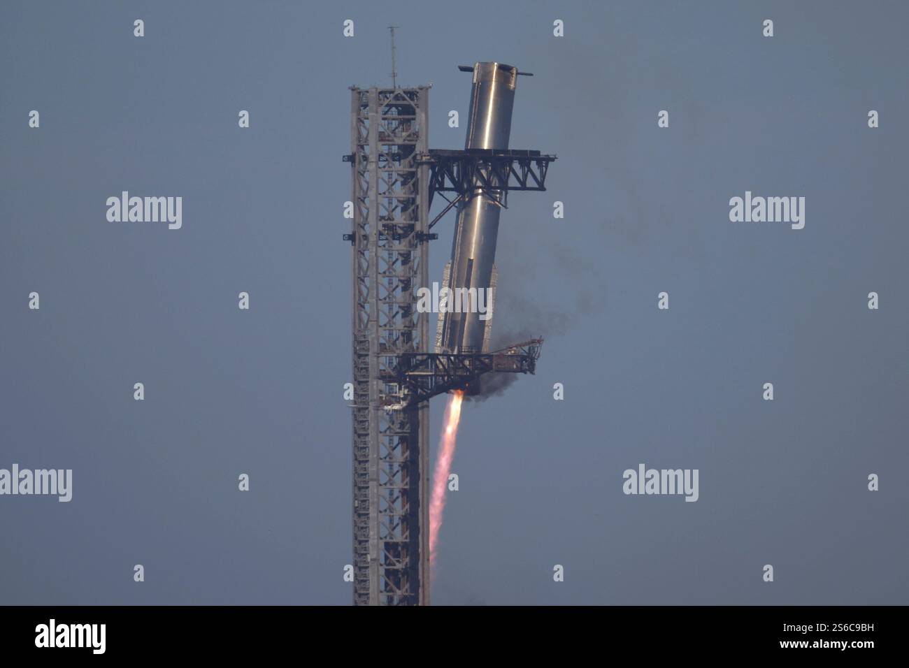 SpaceX's mega rocket Starship booster returns to the launch pad during ...