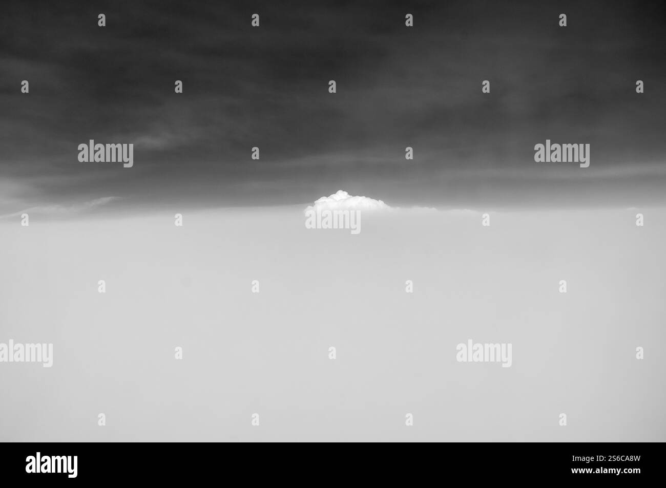 A cloudless sky with a single cloud in the middle. The sky is grey and ...