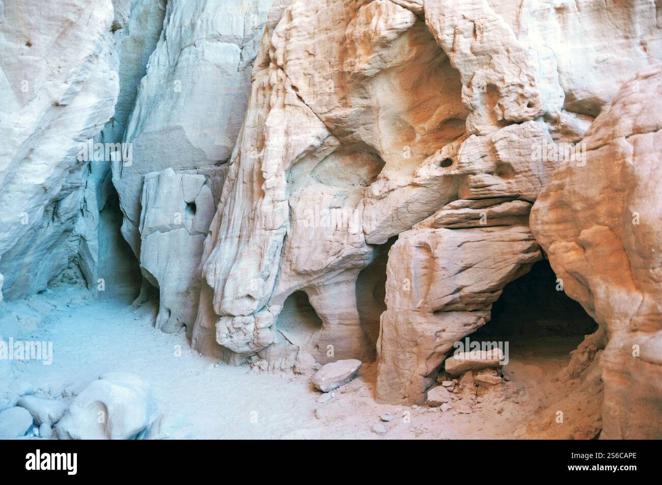 A cave with a large hole in the middle. The cave is made of stone and ...