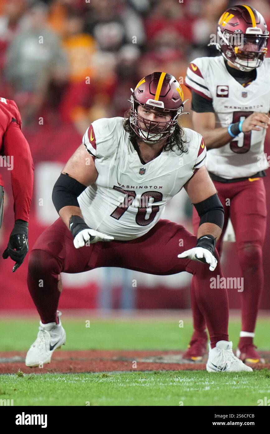 Washington Commanders guard Sam Cosmi (76) protects the passer during ...